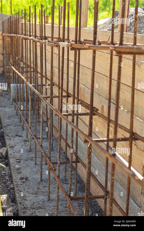 Construction Of A Strip Foundation Reinforcement Strapping Formwork In The Background Stock