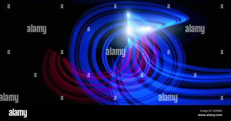 Blue And Red Light Trails Creating An Abstract Swirling Wave Pattern On Black Background Stock