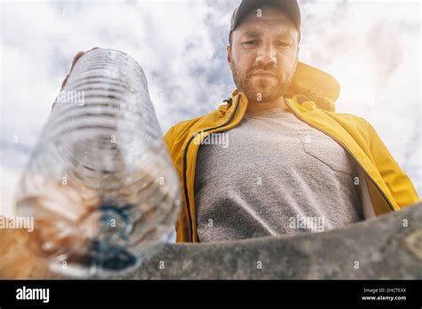 Man Throw Plastic Bottle In To Garbage Stock Photo Alamy