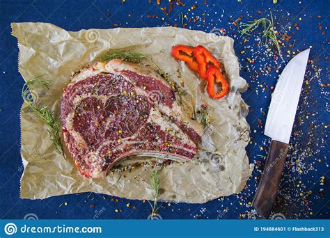 Raw Beef Meat On The Table Spices And Rosemary Rib Eye Steak