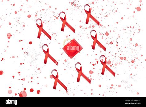 Red Aids Ribbon And Condom With Red Splashes On White Background World