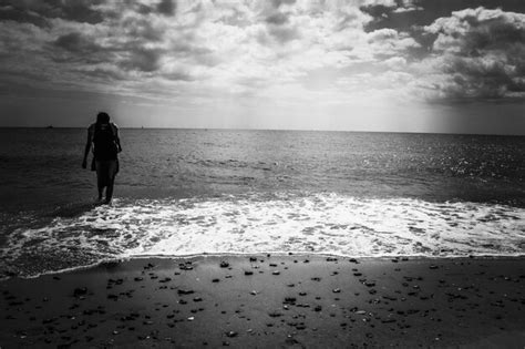 Premium Photo Rear View Of Woman Walking On Beach