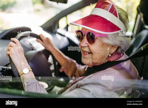 Happy Senior Woman Driving Car Alone Enjoying Car Ride Safe Driving