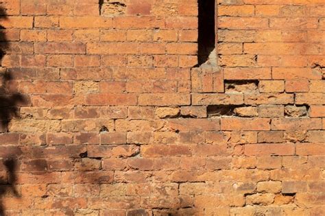La Textura De Las Paredes De Ladrillos De Arcilla Roja Foto Premium