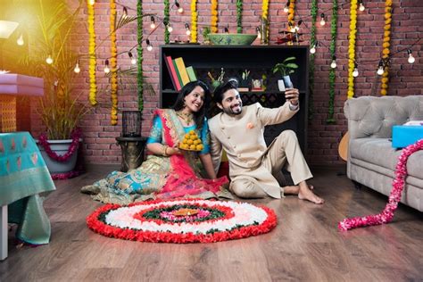 Premium Photo Indian Couple Making Flower Rangoli On Diwali Or Onam