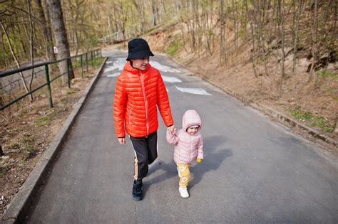 Premium Photo Brother With Sister Walking At Park