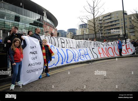 Football Fans Gather Outside The Emirates Stadium Before The Match