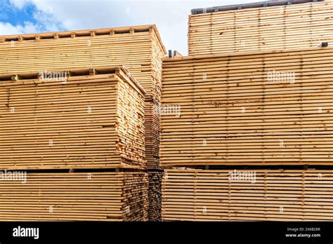 Outdoor Timber Warehouse With Wood Plank Stacks Ready For Shipping In