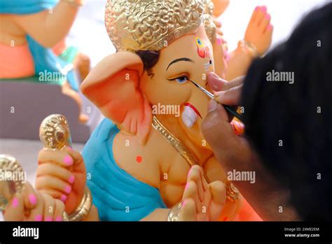 Artist Painting And Giving Final Touches To Lord Ganesha Ahead Of