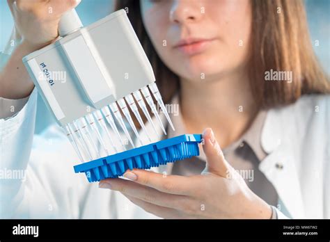 Babe Woman With Multi Pipette And Other PCR Items In Microbiological Genetic Laboratory