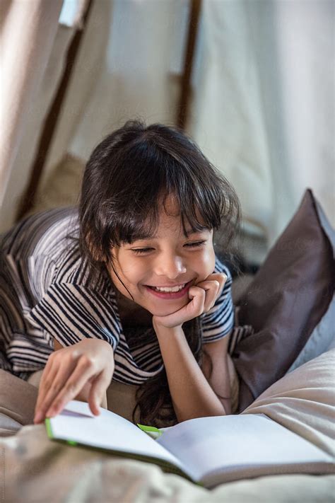 Cute Japanese Girl Reading A Book By Stocksy Contributor Jovo