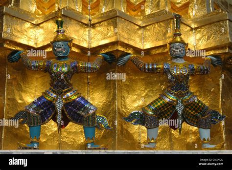 Yaksha Demon Statues Guard The Golden Chedi In Wat Phra Kaew In Bangkok