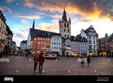Hauptmarkt Square In Trier Germany And Baroque Petrusbrunnen Fountain