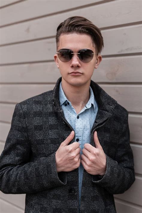 Modern Young Man Hipster With Stylish Hairstyle In Trendy Sunglasses In