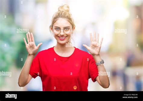 Young Beautiful Blonde Woman Wearing Red T Shirt And Glasses Over