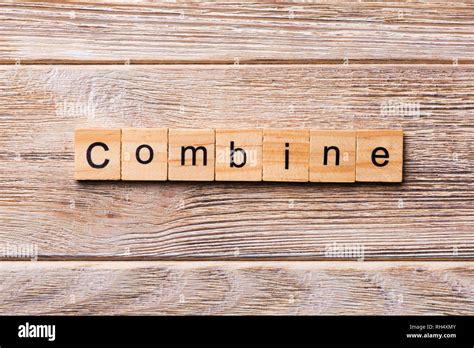 COMBINE Word Written On Wood Block COMBINE Text On Wooden Table For Your Desing Concept Stock
