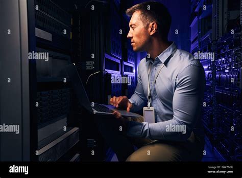 IT Professional Checking Data Center Hardware Equipment Stock Photo Alamy