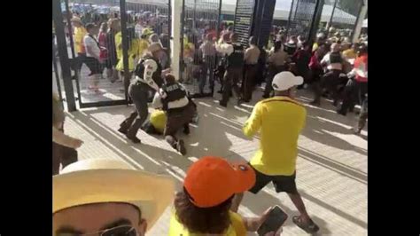 Police Wrestle Fans To Ground As Thousands Storm Copa America Final