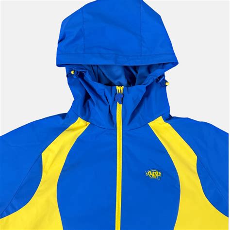 Syna Logo Vortex Woven Jacket Blue Yelllow No Sauce The Plug