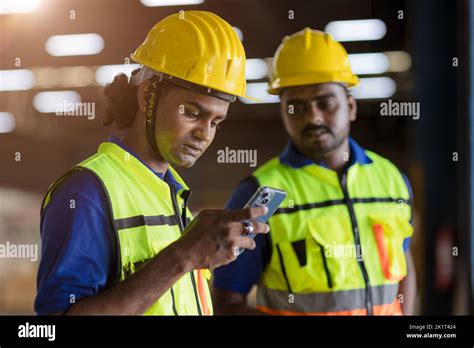 Factory Engineer Worker Reading Bad News Lay Off Notify At Smartphone