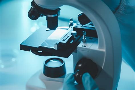 Premium Photo Female Medic In Uniform Working With Microscope Making Analysis At The