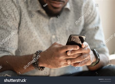 Hand Holds Mobile Phone And Scrolls Up Web Images Stock Photos