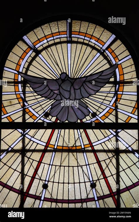Stained Glass Window Depicting A White Dove Symbol Of Peace Stock