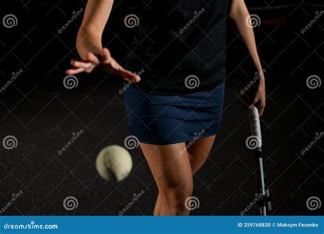 View On Part Of Body Of Woman Tennis Player With Tennis Racket In Her