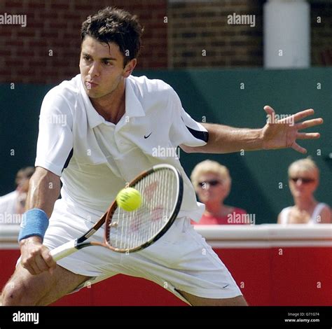 Croatias Mario Ancic Volleys Against Usas Andy Roddick During The