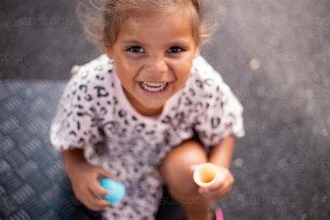 Image Of Out Of Focus Young Aboriginal Girl Playing At Preschool