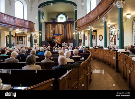 People Sitting Inside The First Presbyterian Church Belfast Stock