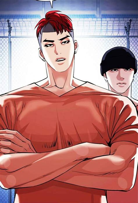 Two Men Standing Next To Each Other With Their Arms Crossed