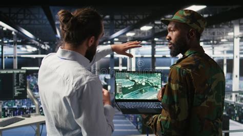 Drone Operators In Military Data Center Supervising Autonomous Flight Systems Stock Footage