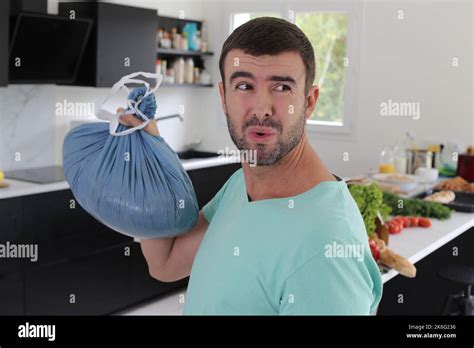 Disgusted Man Holding Stinky Garbage Bag Stock Photo Alamy
