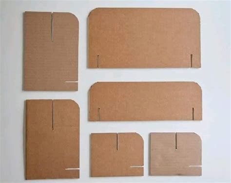 Cama para muñecas hecha de cartón