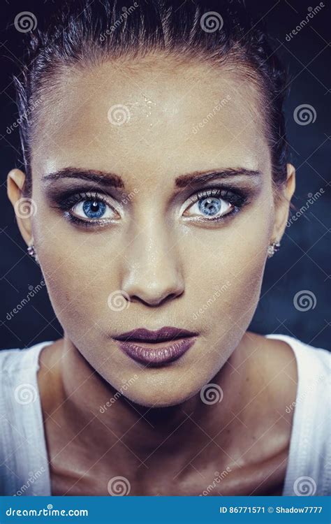 Brunette Girl With Beautiful Make Up And Wet In A Spray Of Water Stock