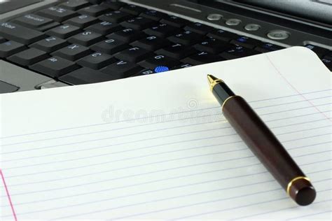 Pen Notepad And Keyboard Ballpoint Pen Resting On A Lined Notepad
