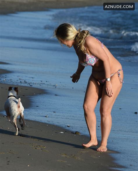 Frankie Essex Jogs On The Beaches Of Tenerife With Her Multicolored