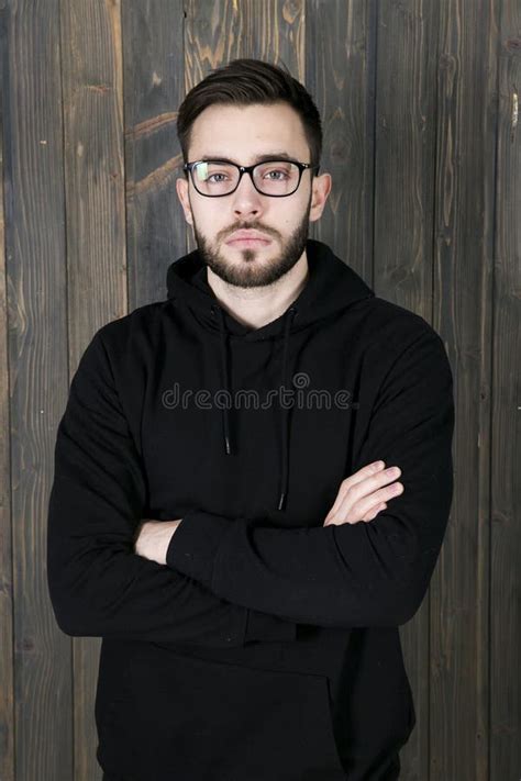 Attractive Young Man With A Small Beard Wearing Glasses And Wear Stock