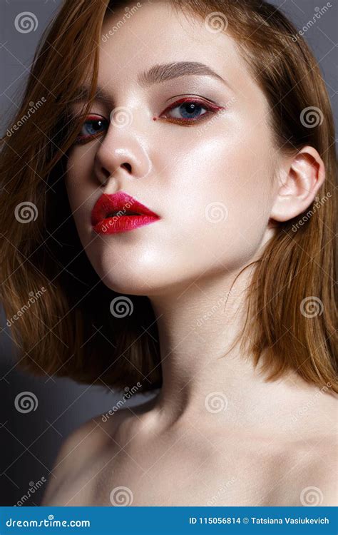 Young Girl With Red Lips And Red Arrows In Front Of Eyes Beautiful