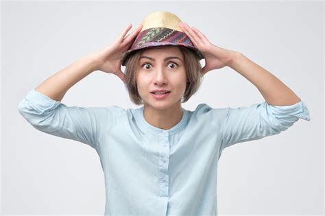 Premium Photo Confused Woman Puts Her Hands On The Head