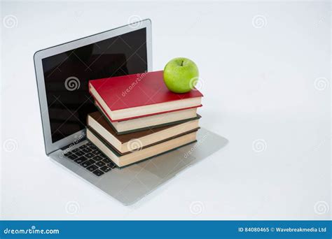 Laptop Stack Of Books And Apple On White Background Stock Image