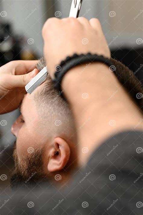 The Barber Makes The Outline With A Dangerous Razor The Undercut