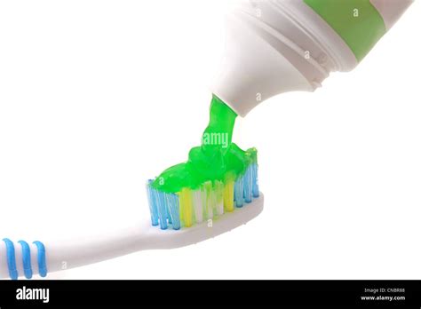 Toothpaste Coming Out Of A Tube On Toothbrush On White Background Stock