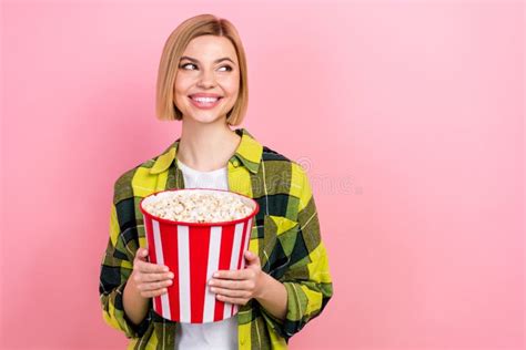 Photo Portrait Of Pretty Young Girl Look Empty Space Hold Popcorn