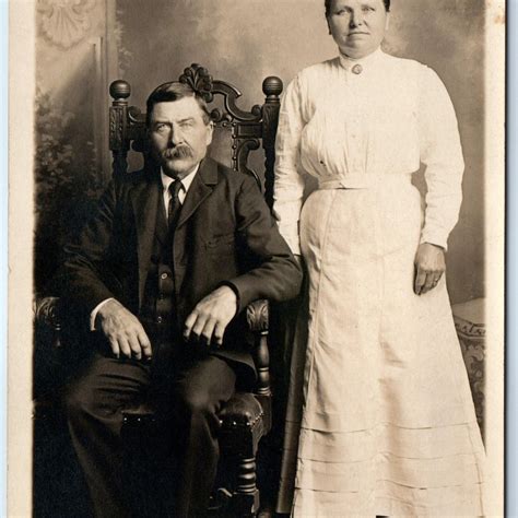 C1910s Middle Aged Married Couple Rppc Man Woman Lady Wood Chair Real
