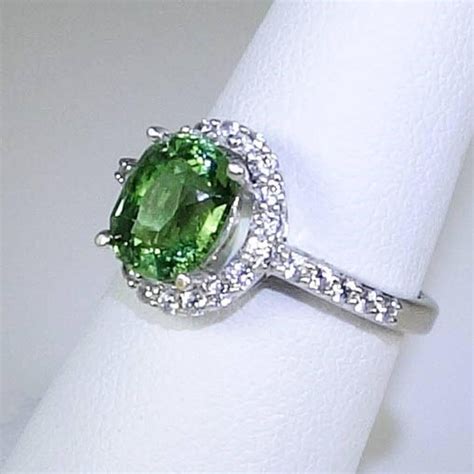 Ajd Glowing Oval Green Tourmaline Halo Set In Sterling Silver For Sale