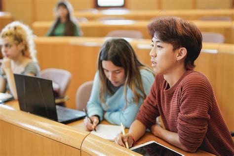 Premium Photo Young Diverse Sutdents Learning Together Inside