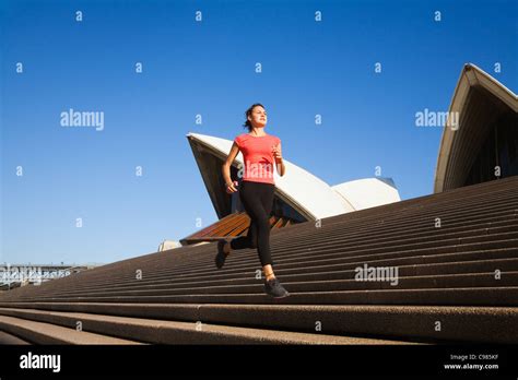 Woman Running On Steps Of Sydney Opera House Sydney New South Wales