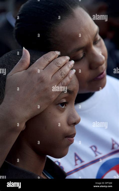 Betty Chatman Holds Onto Her Son Isaiah 11 During A Vigil To Honor The Four Oakland Police